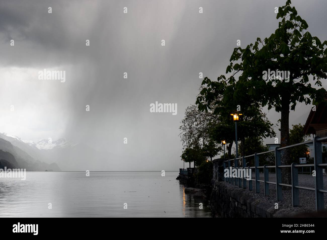 A stormy rain cell above a lake in a rural area Stock Photo - Alamy
