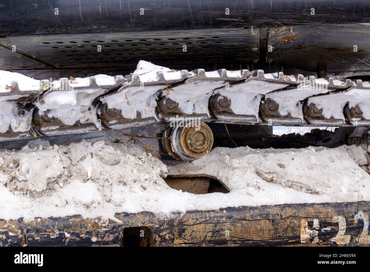 the carrier roller keeps the sagging track clogged with compressed snow ...