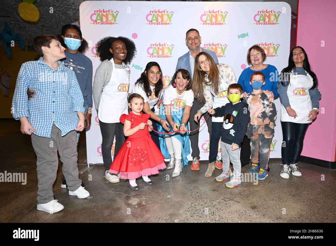 New York, USA. 27th Nov, 2021. Chef Cricket Azima (blue dress), along ...