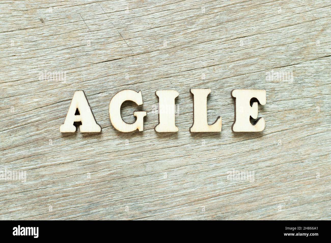 Alphabet letter in word agile on wood background Stock Photo - Alamy