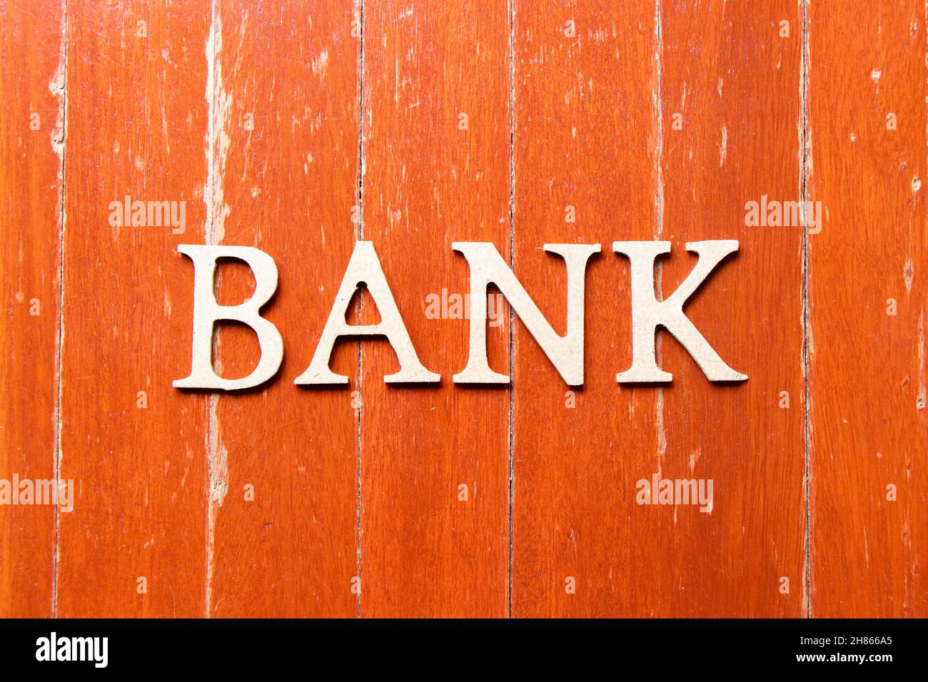 Alphabet letter in word bank on old red color wood plate background ...