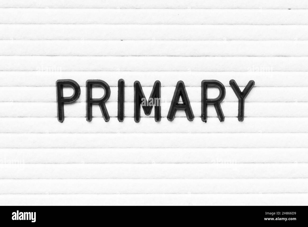 Black letter in word primary on white felt board background Stock Photo ...