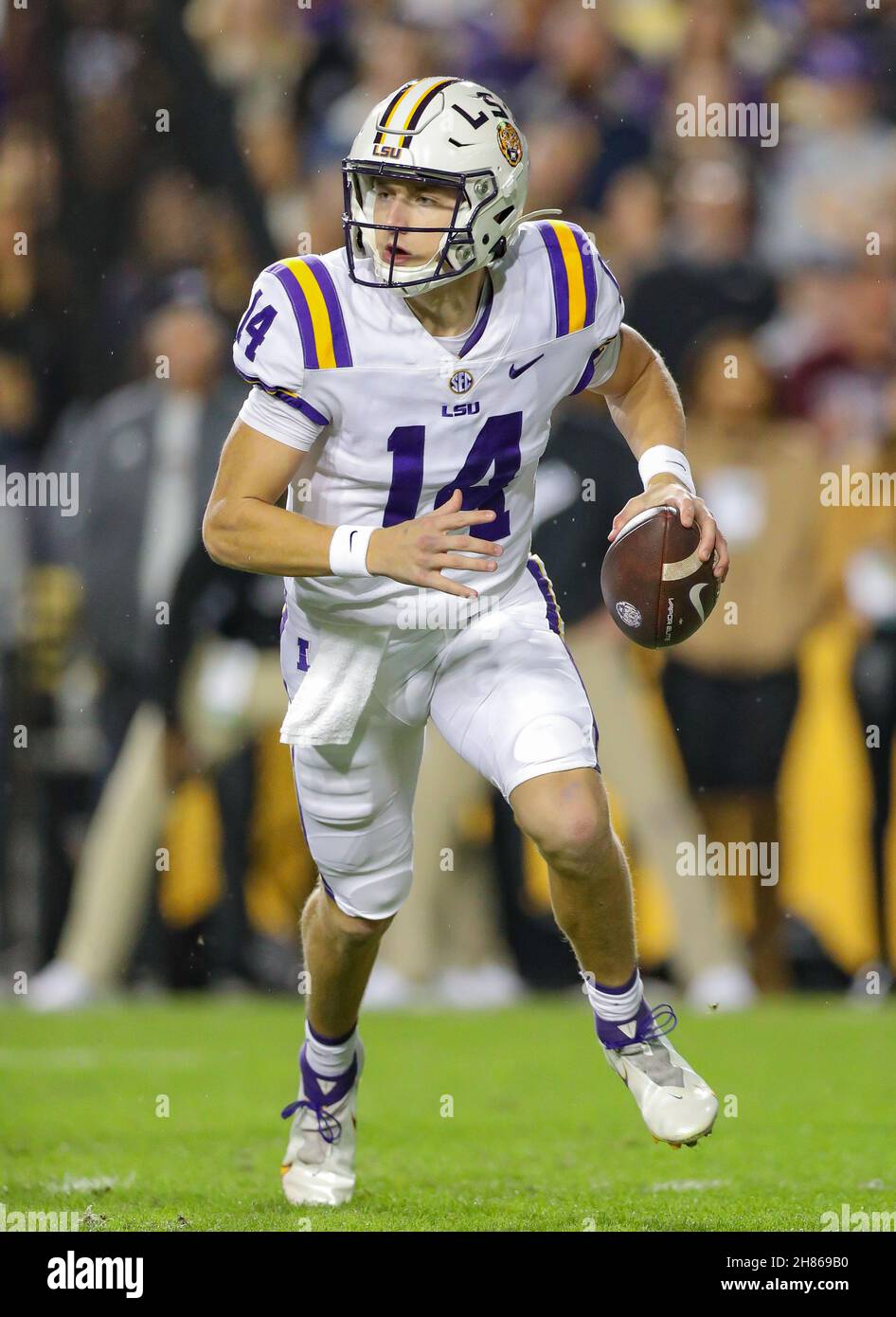Baton Rouge, LA, USA. 27th Nov, 2021. LSU QB Max Johnson #14 escapes ...