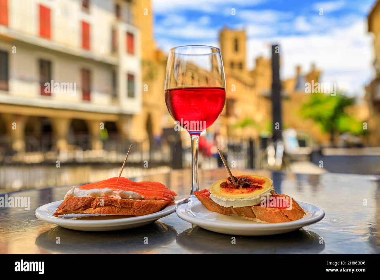 Tostadas with salmon and crab and baked cheese pintxos or tapas with a ...