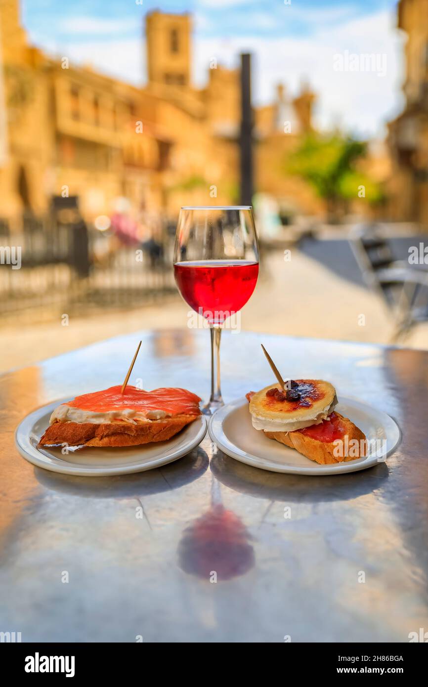 Tostadas with salmon and crab and baked cheese pintxos or tapas with a ...