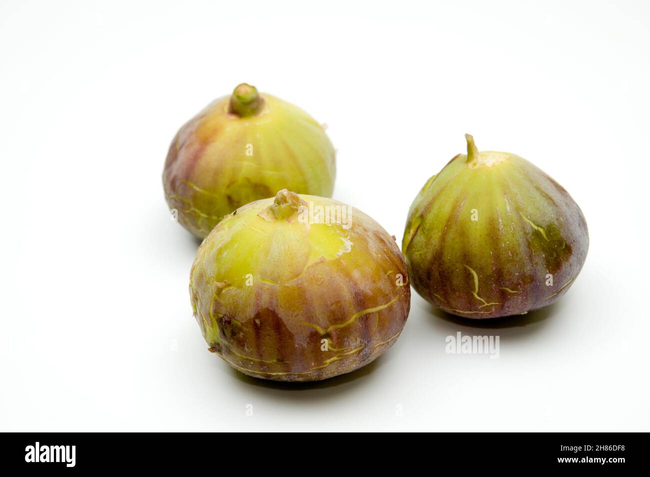 Three Fresh ripe figs on white background Stock Photo - Alamy