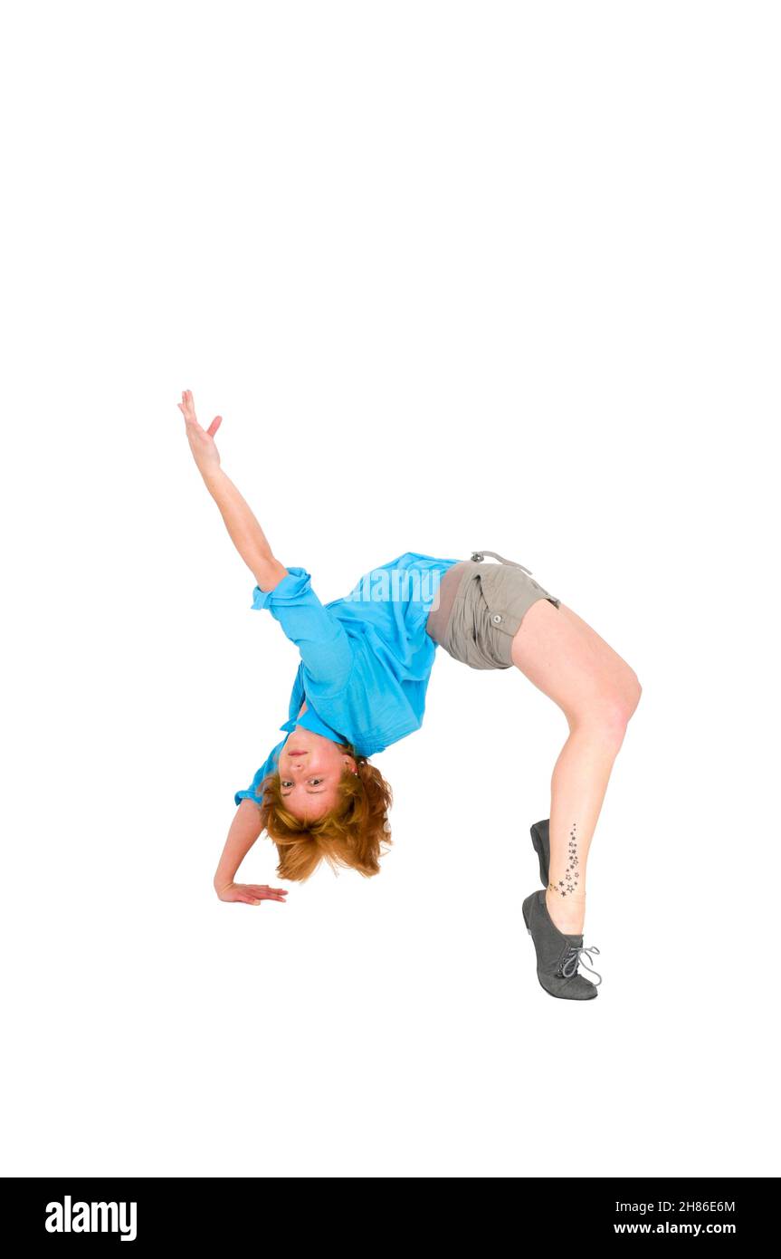 flexible Female acrobat bends over backwards On white Background Stock ...