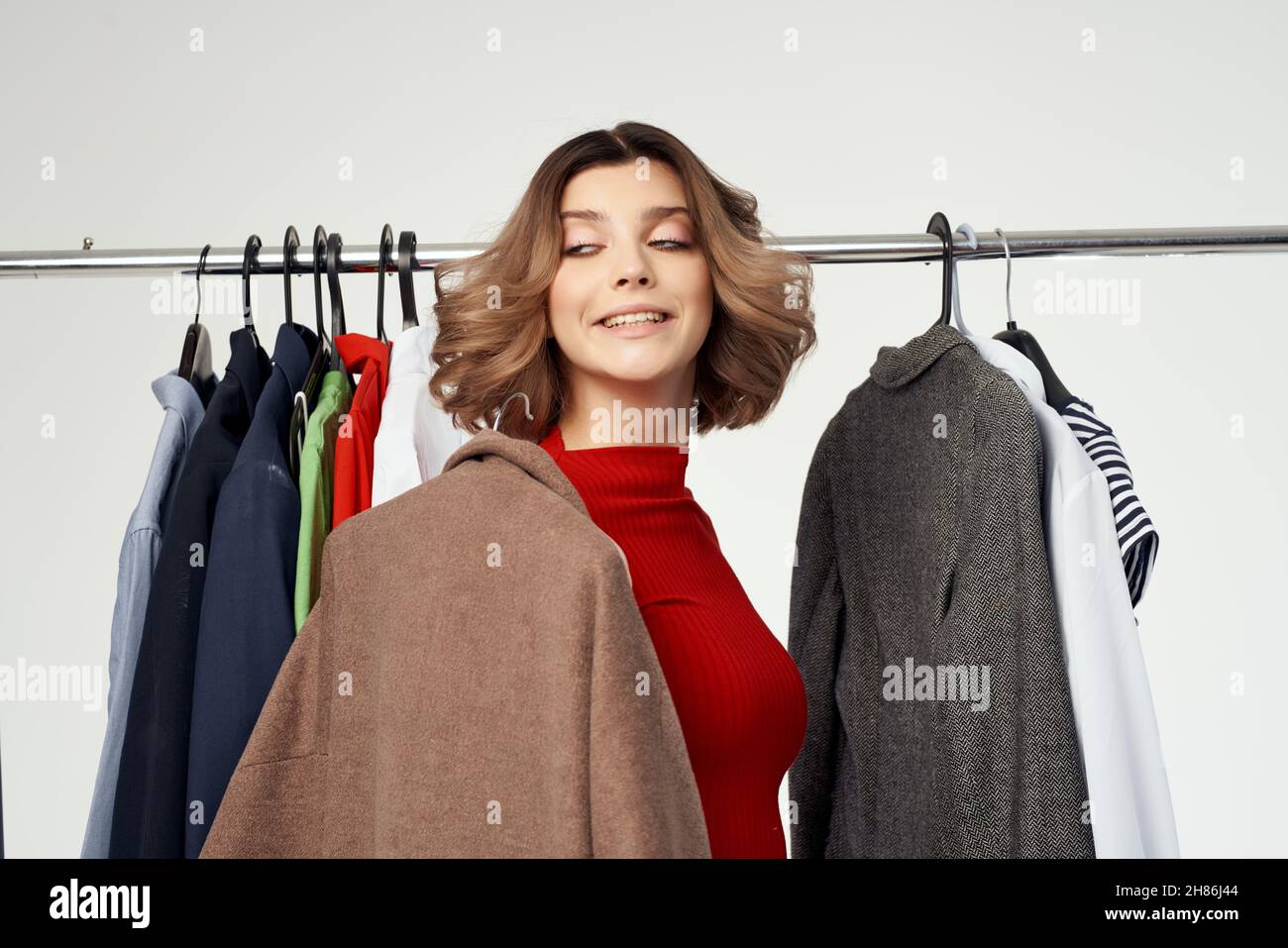 cheerful woman trying on clothes shop shopaholic isolated background ...