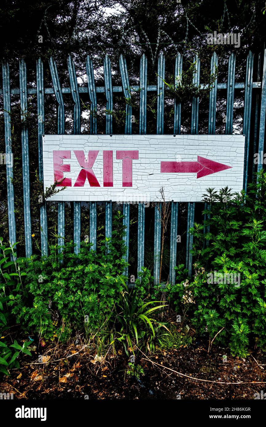 exit sign mounted on security railings Stock Photo - Alamy