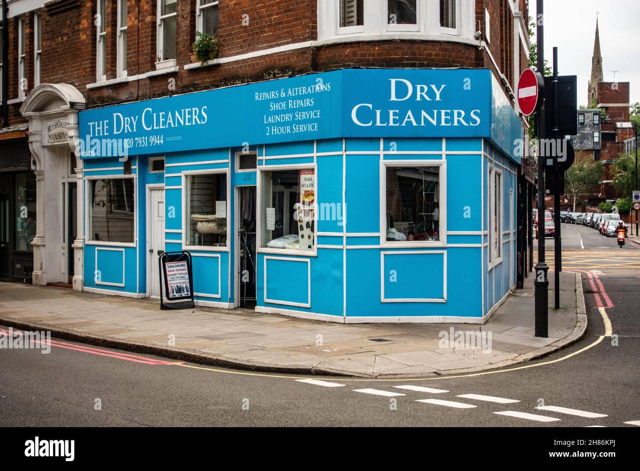 Corner shop, dry cleaners in Belsize Park, London Stock Photo - Alamy
