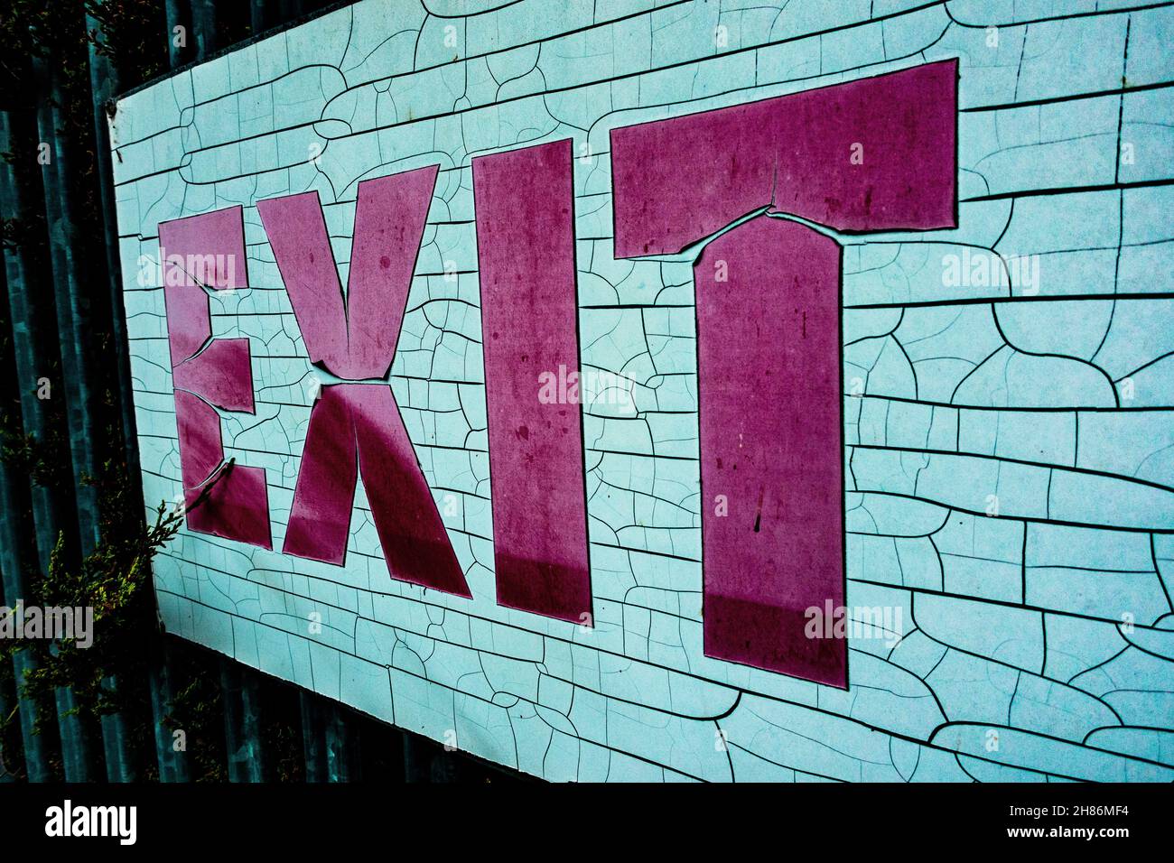 exit sign mounted on security railings Stock Photo - Alamy