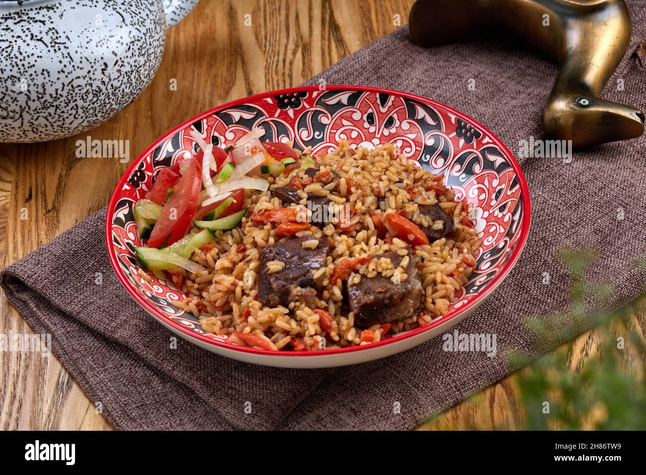 Uzbek pilaf. Traditional style plate with delicious homemade plov Stock ...