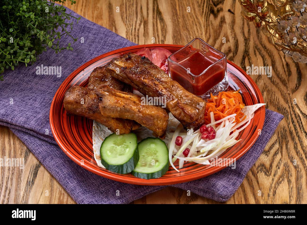 Grilled pork ribs with vegetables on rustic wood background Stock Photo ...