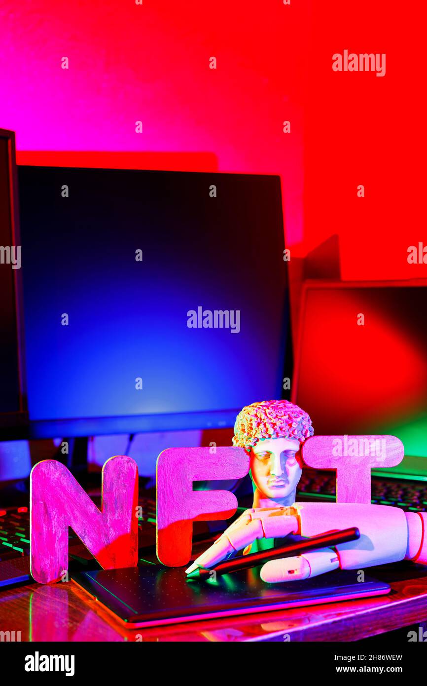 NFT (Non-Fungible token). Artificial hand creates crypto art using a ...