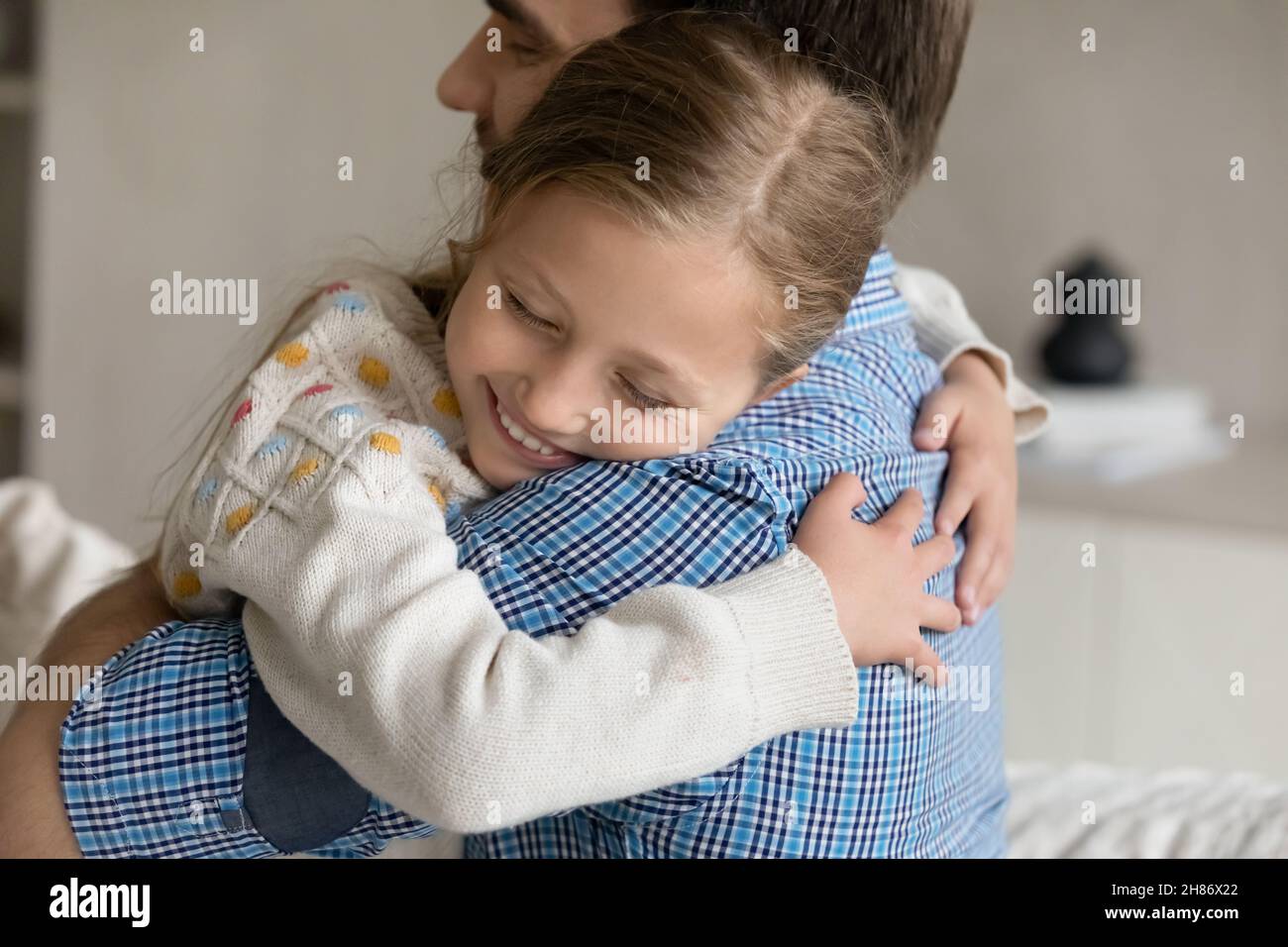 Smiling cute little child girl cuddling loving young father Stock Photo ...