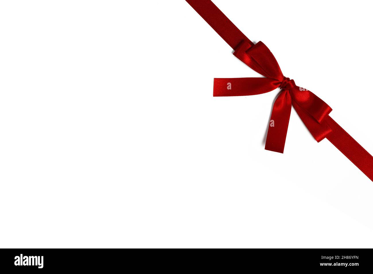 Elegant satin red ribbon bow isolated on white background Stock Photo ...