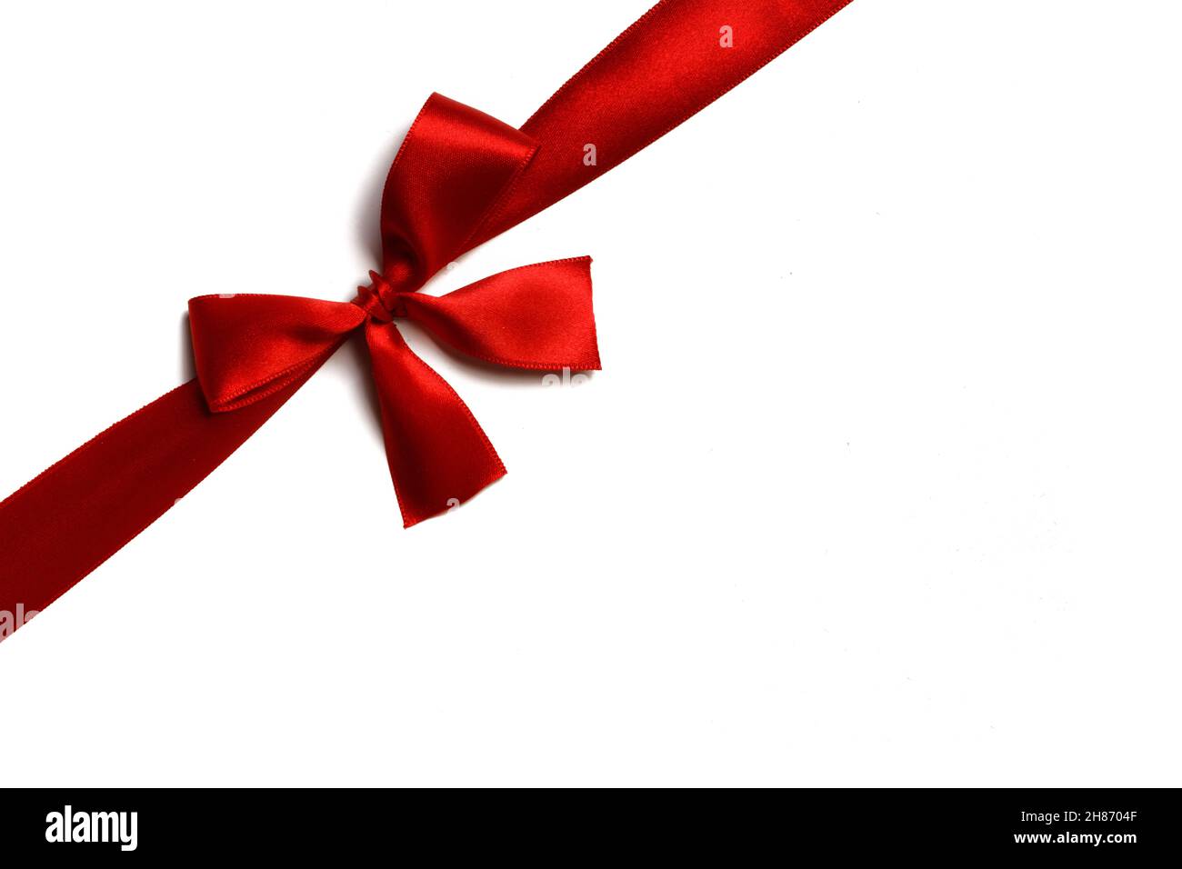 Elegant satin red ribbon bow isolated on white background Stock Photo ...