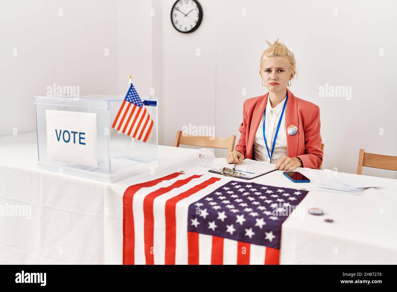 Beautiful caucasian woman working at political campaign depressed and ...