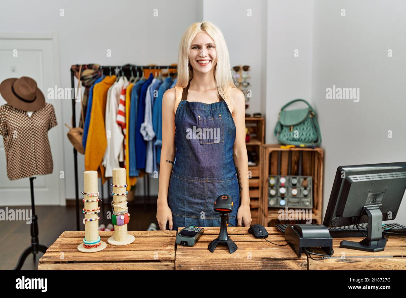 Beautiful caucasian woman working as manager at retail boutique looking ...