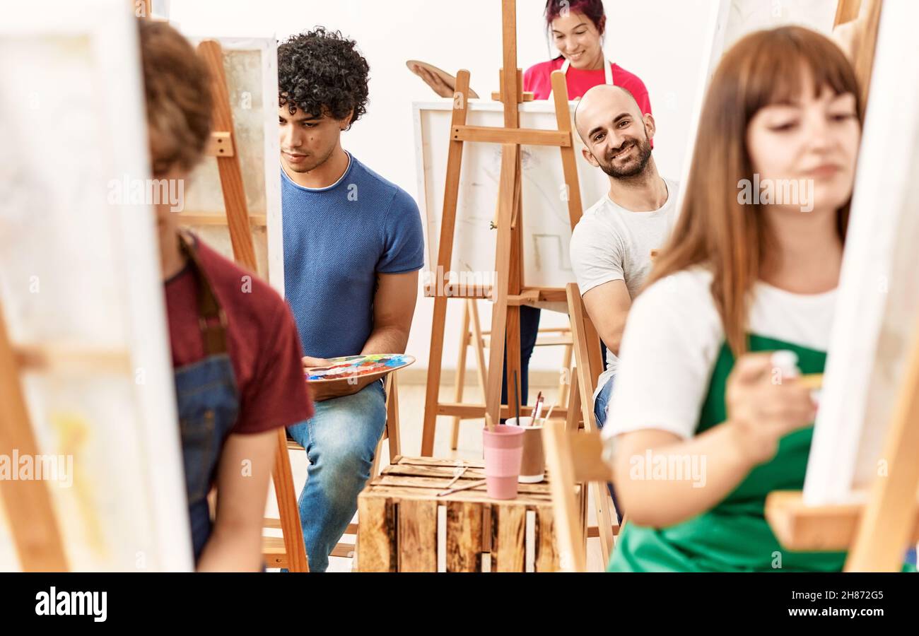 Group of young draw students smiling happy drawing at art studio Stock ...
