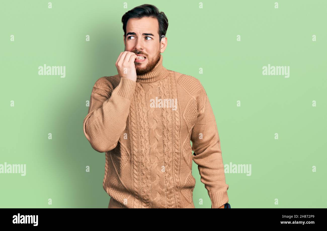 Young hispanic man wearing casual clothes looking stressed and nervous ...