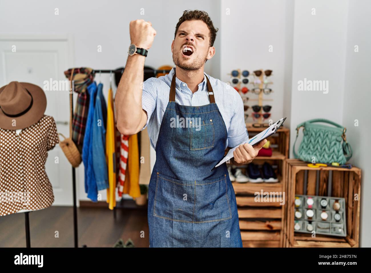 Male shop assistant unhappy hi-res stock photography and images - Alamy