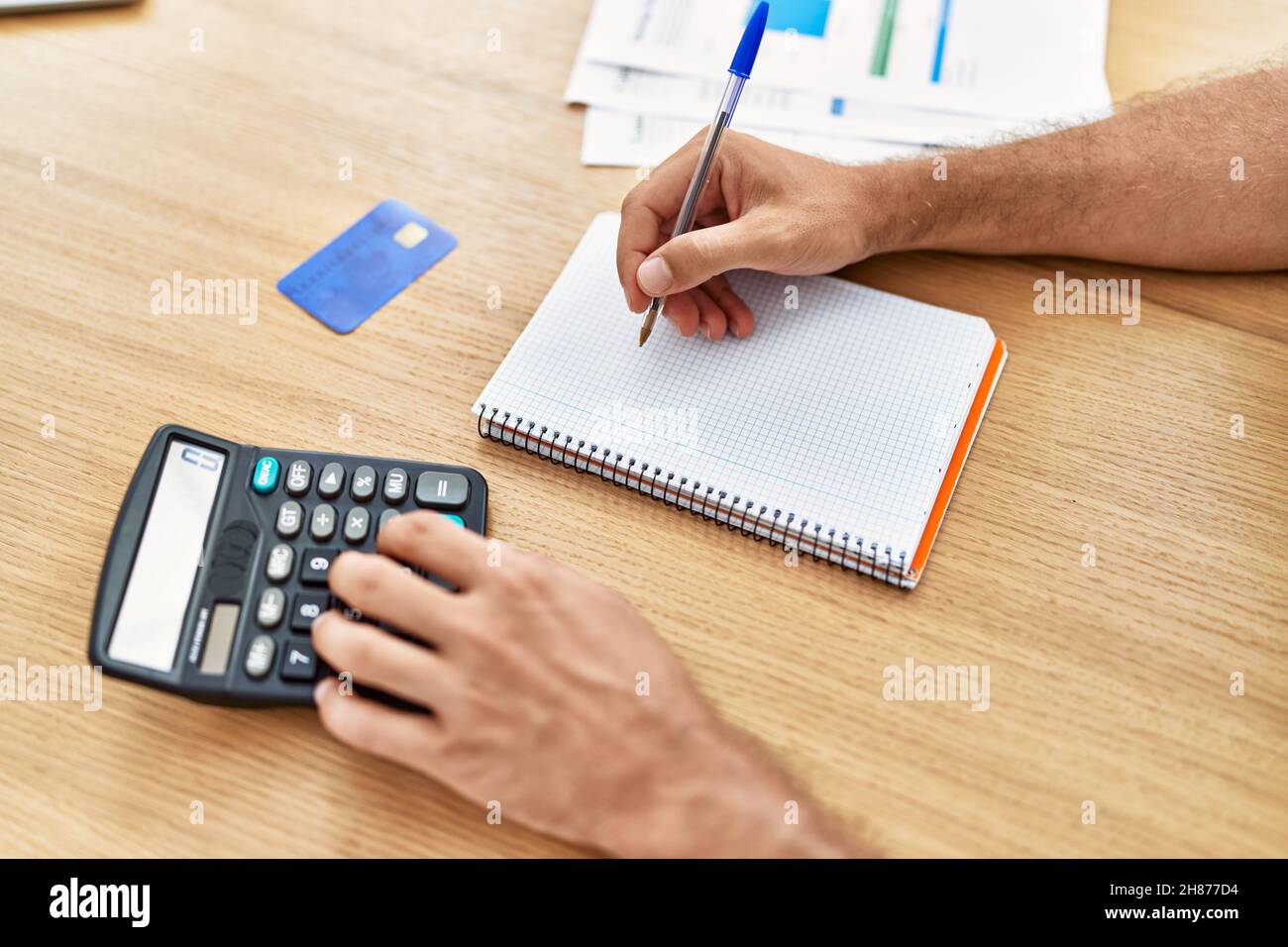Hand of businessman controlling economy at the office Stock Photo - Alamy