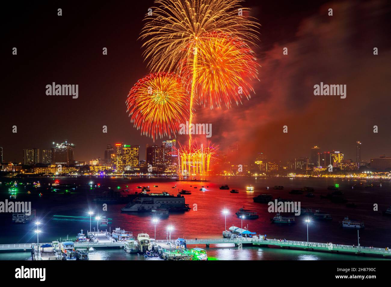 fantastic and colorful fireworks display over the night sky of the city ...