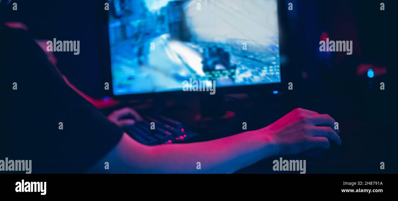 Professional gamer playing online games tournaments pc computer with ...