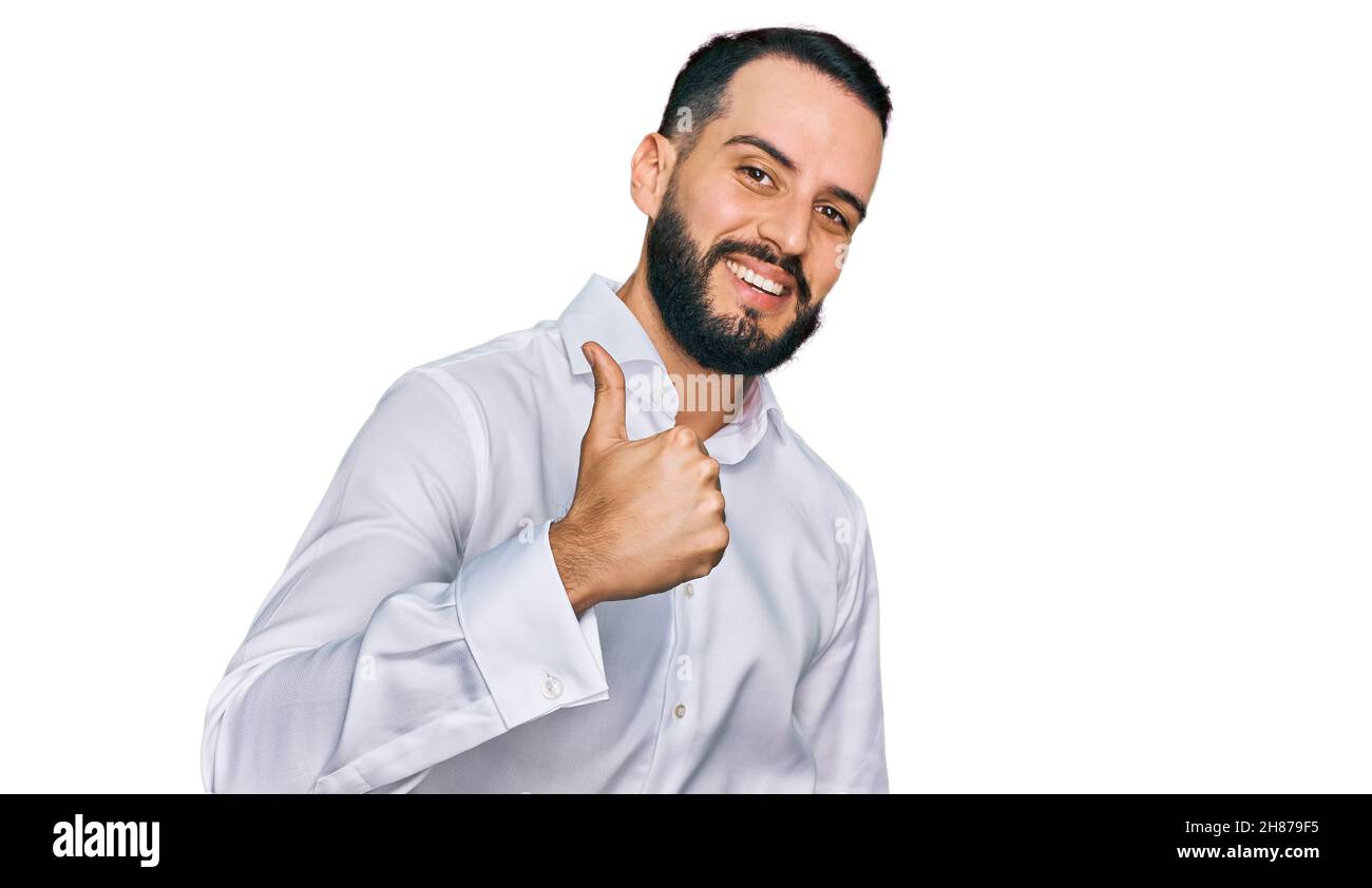 Young man with beard wearing business shirt doing happy thumbs up ...