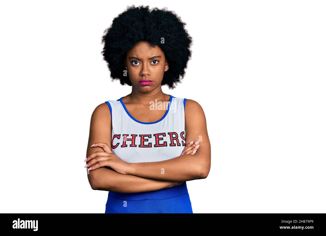 Young african american woman wearing cheerleader uniform skeptic and ...