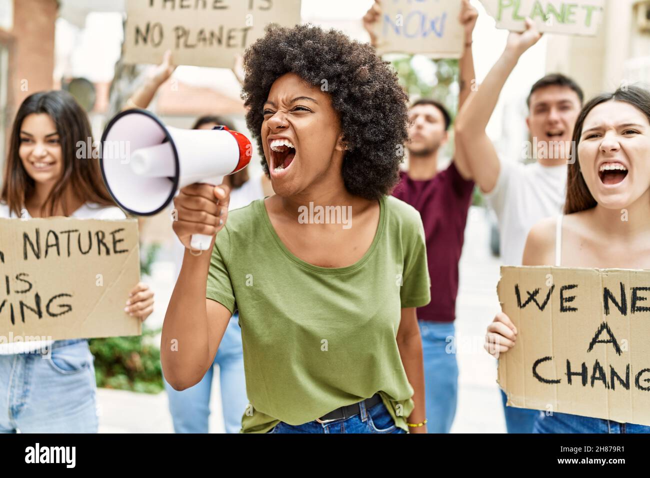 Interracial people protesting banner megaphone hi-res stock photography ...