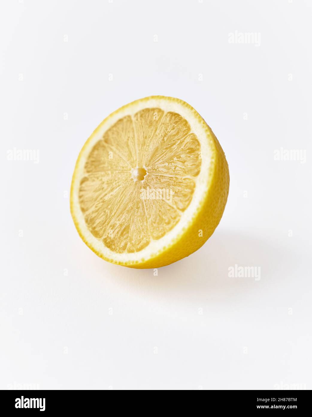 Lemon half fruit isolated on a white background Stock Photo - Alamy