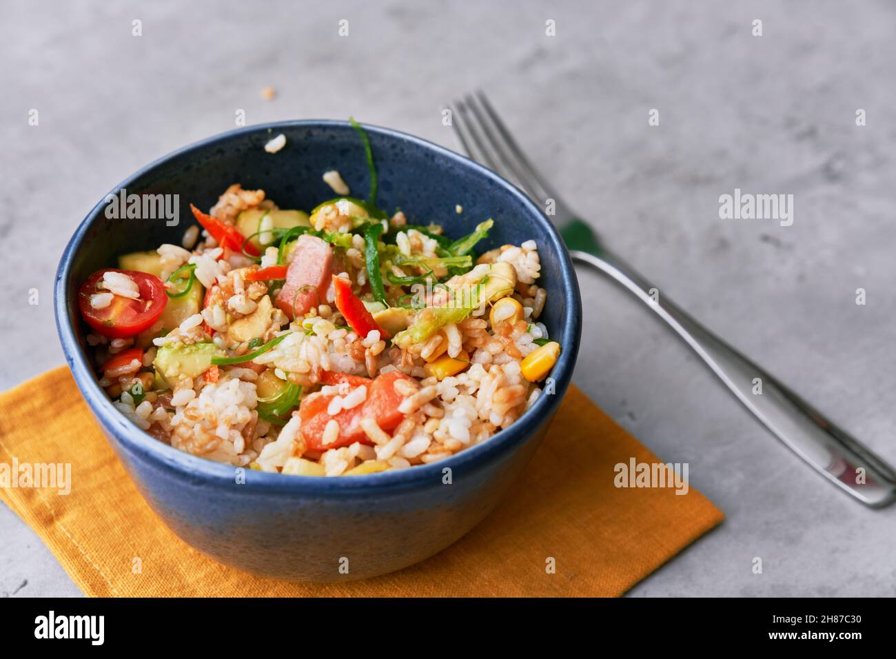Delicious poke bowl on a concrete surface Stock Photo - Alamy
