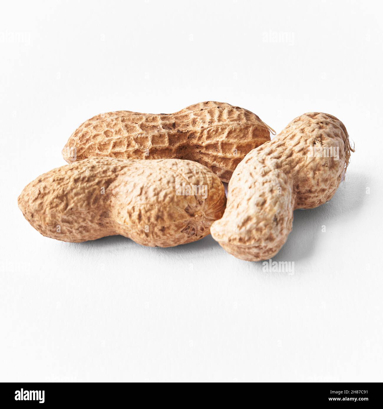 Bunch of peanuts with shell isolated on a white background Stock Photo ...
