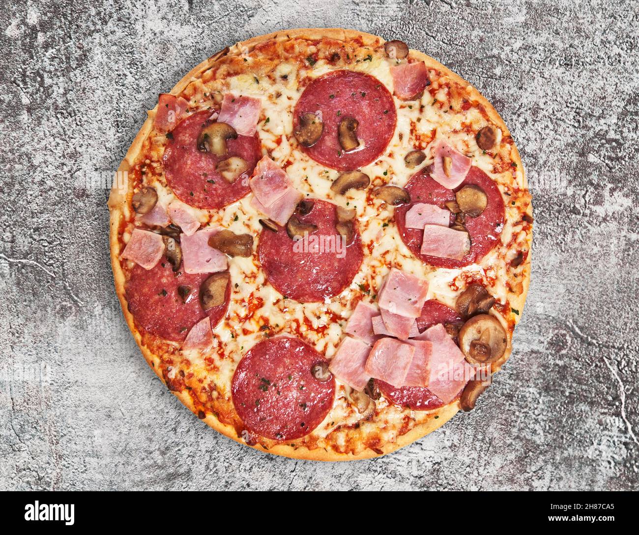 Delicious italian pizza on a concrete surface Stock Photo - Alamy