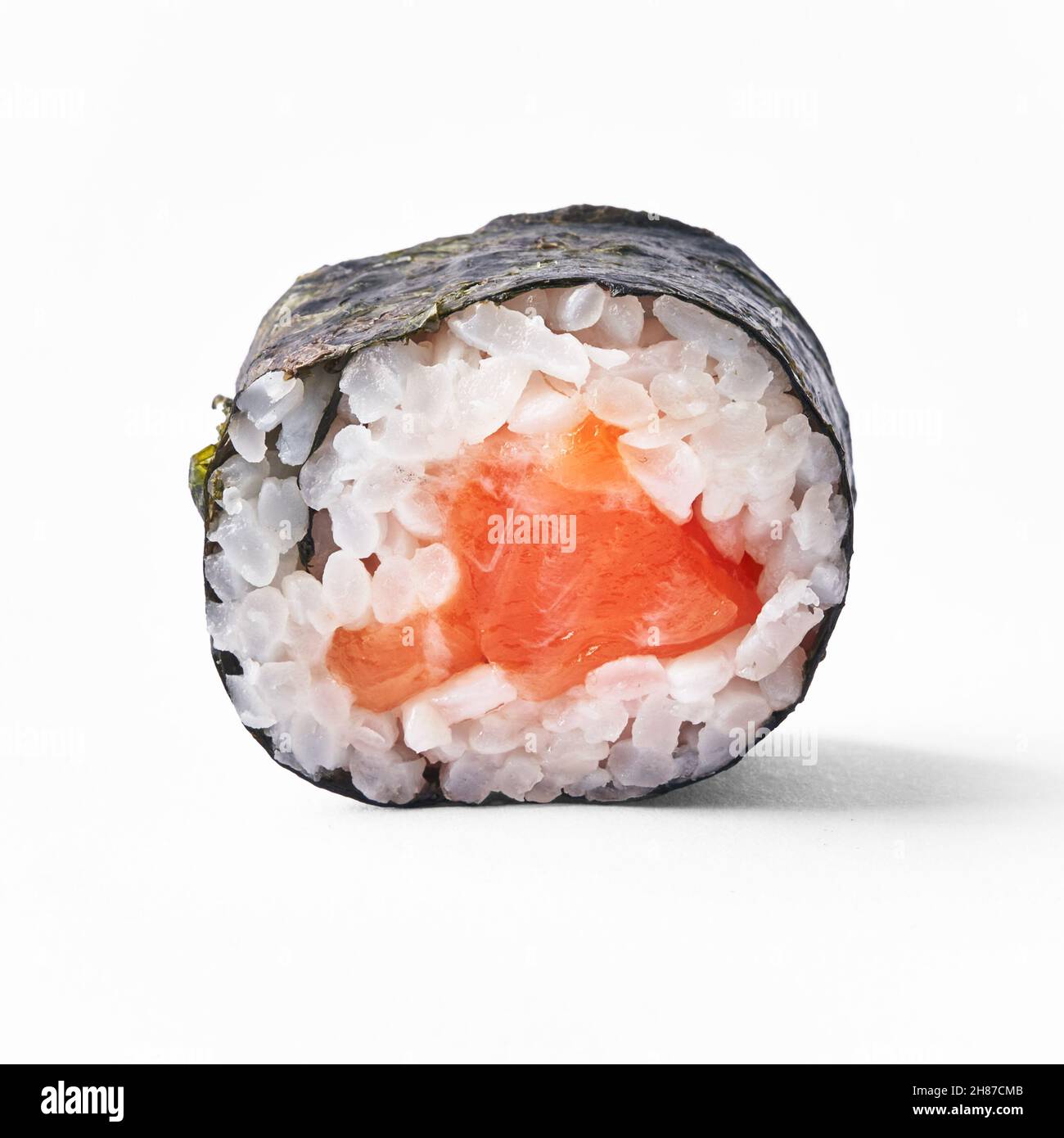 Single salmon sushi maki isolated on white background Stock Photo - Alamy
