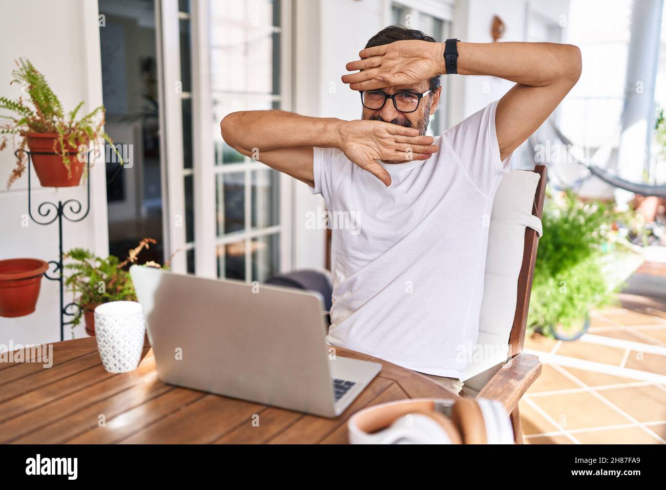 Middle age man using computer laptop at home smiling cheerful playing ...
