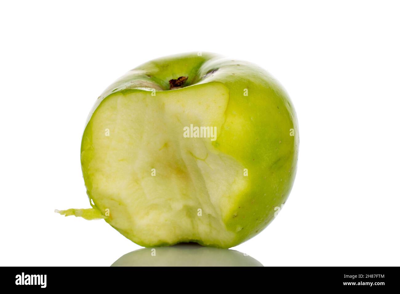 One bitten green apple by Renet Simirenko, close-up, isolated on white ...