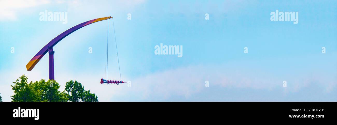 landscape of an amusement park with rocket rides attraction showing ...