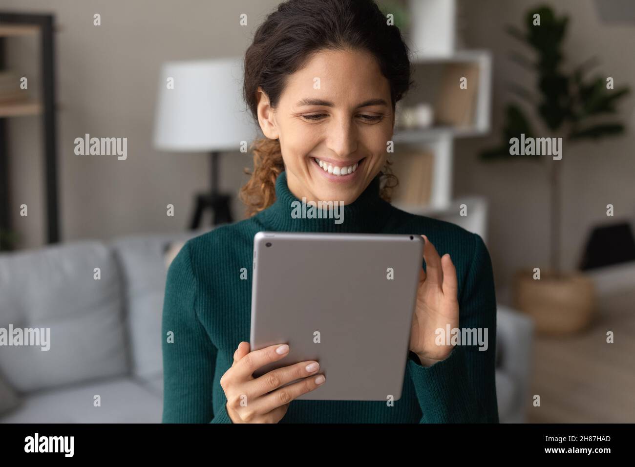 Happy smiling young lady electronic tablet user enjoy easy shopping ...