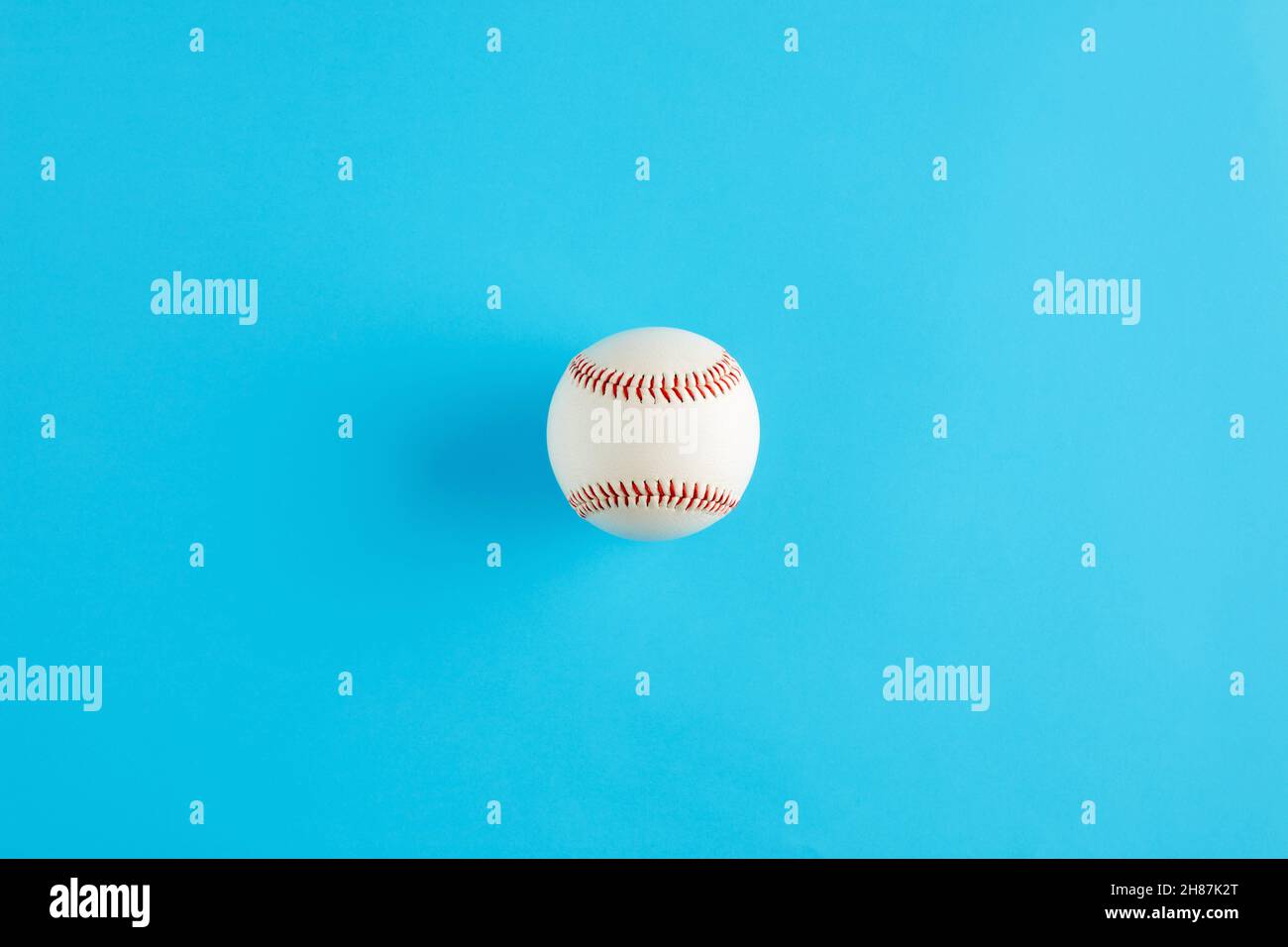 Baseball ball on blue background with copy space. Top view Stock Photo ...