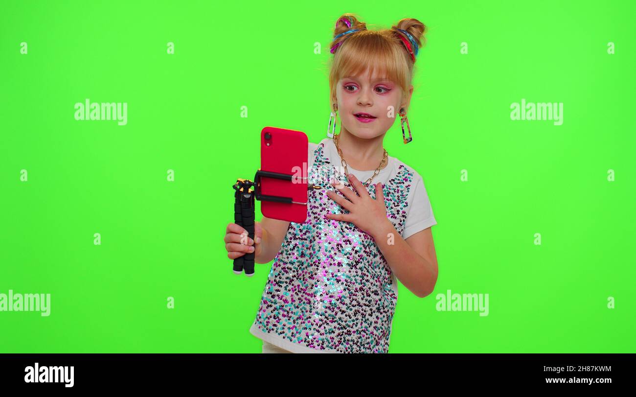 Happy funky blogger child kid girl, recording funny dancing video on ...