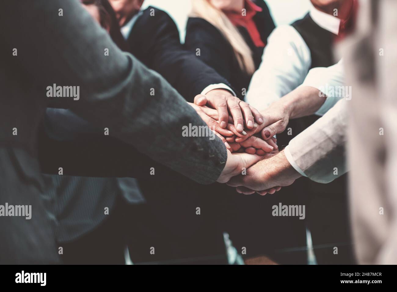 close up. group of business people putting their palms together. the ...