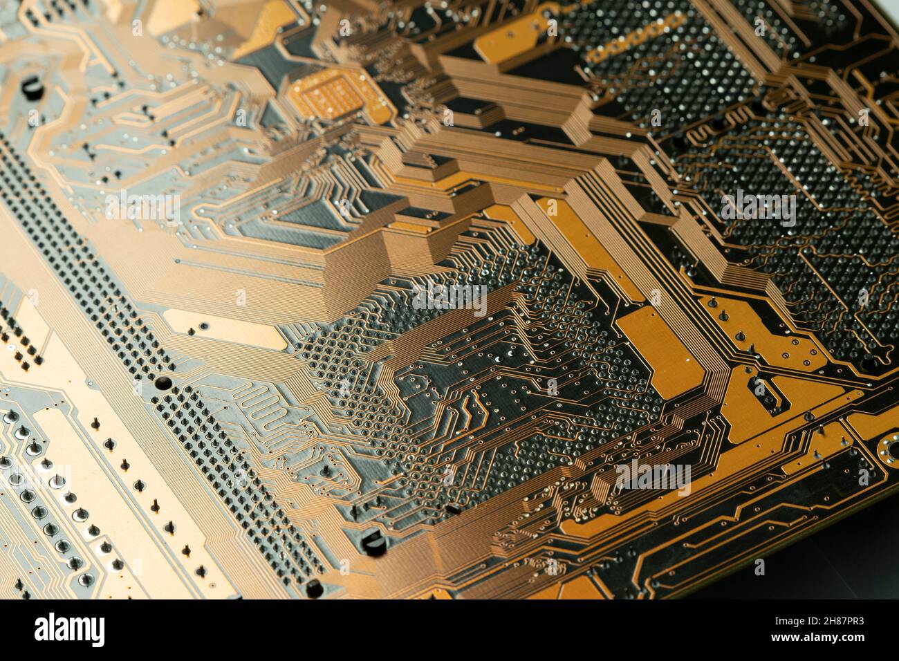 A yellow electronic circuit motherboard Stock Photo - Alamy