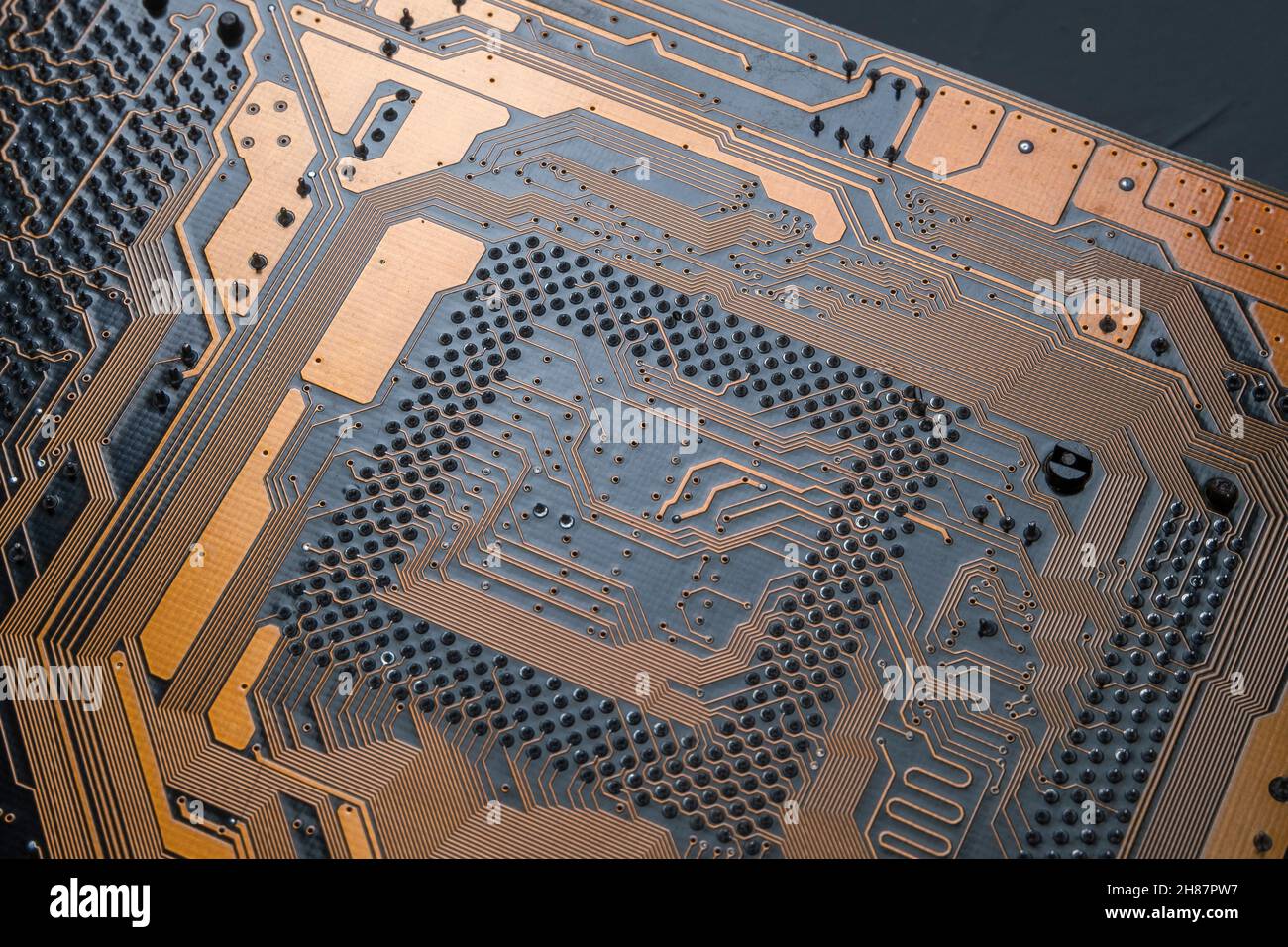 A yellow electronic circuit motherboard Stock Photo - Alamy