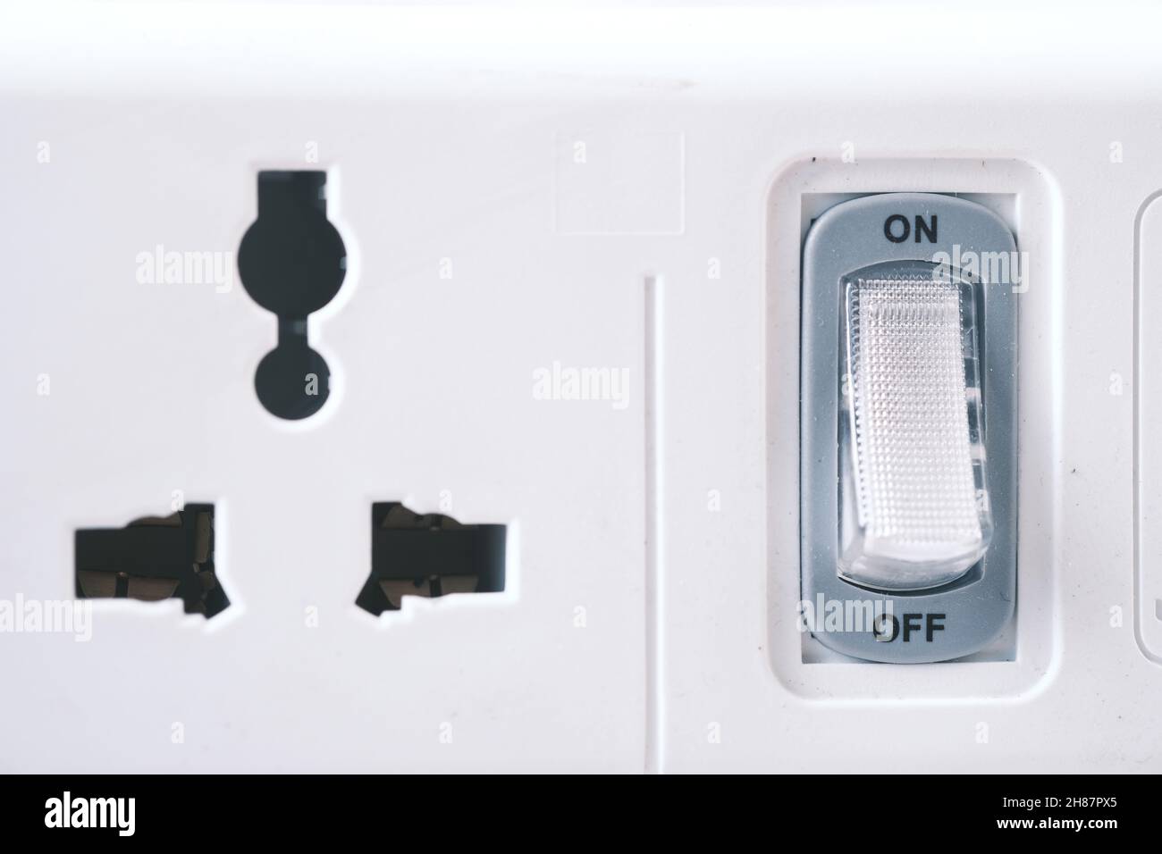 Electrical switch and plug on color background Stock Photo - Alamy