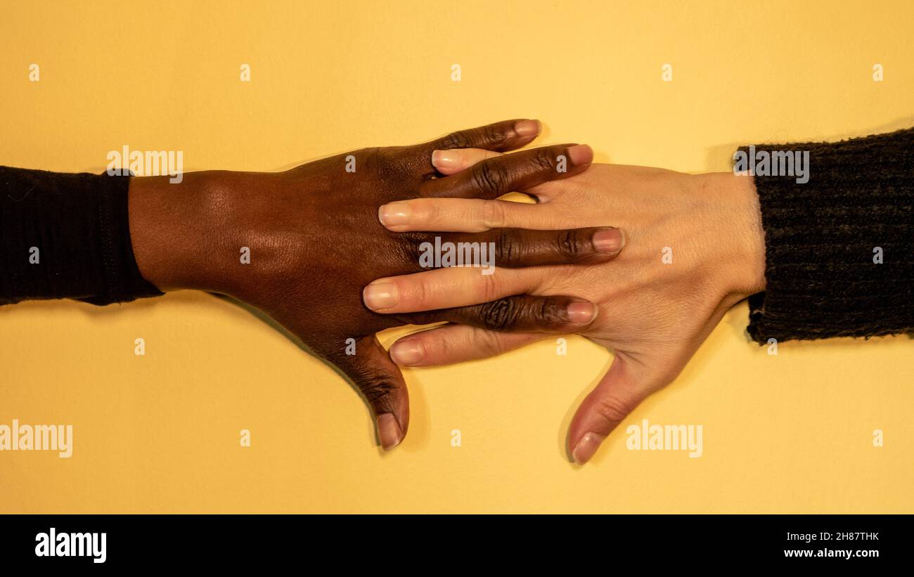 white hand black hand Stock Photo - Alamy
