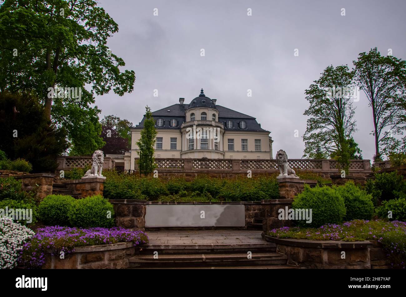 Beautiful white big house with beautiful garden in front Stock Photo ...