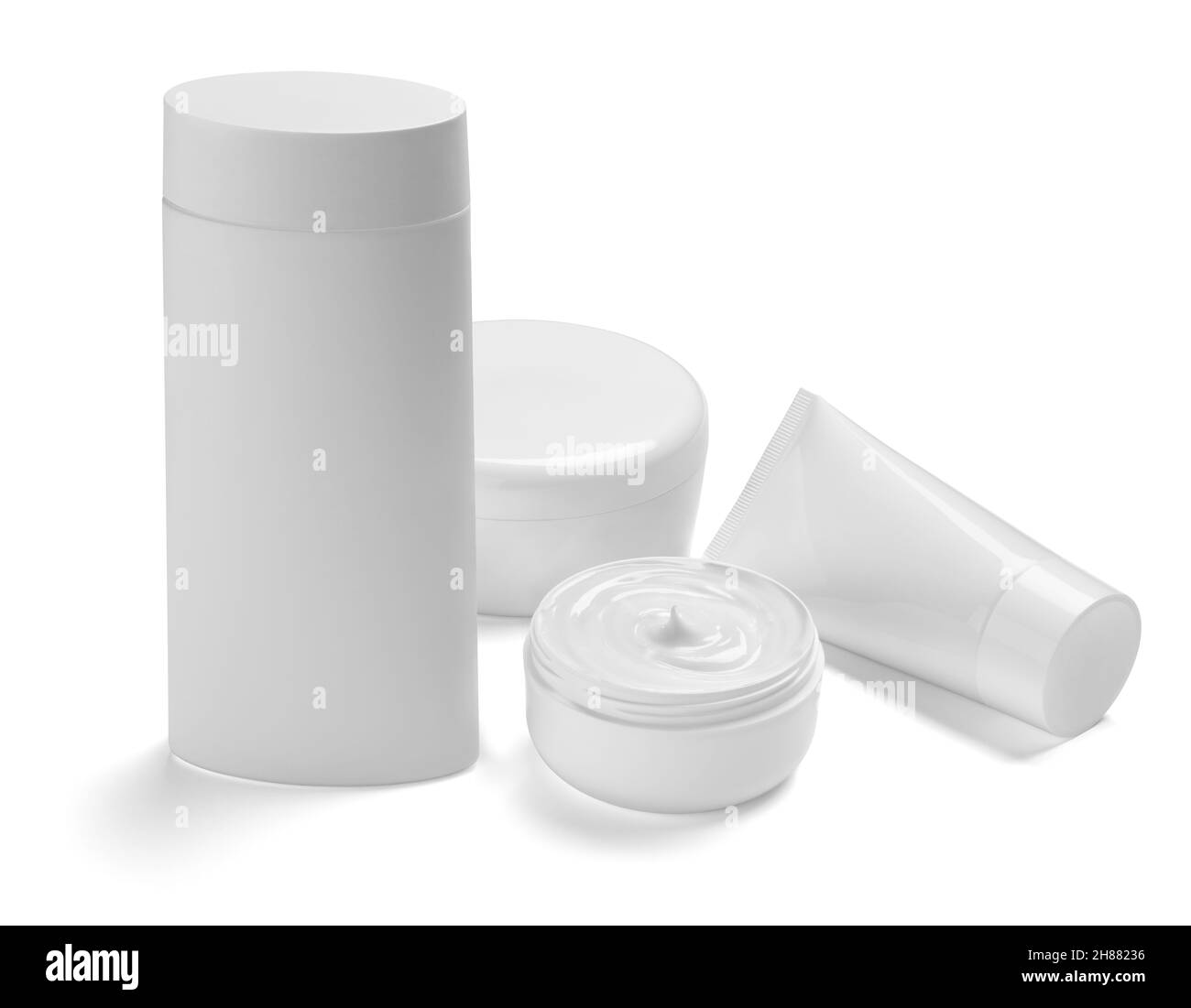 close up of a white beauty cream container and tube on white background ...